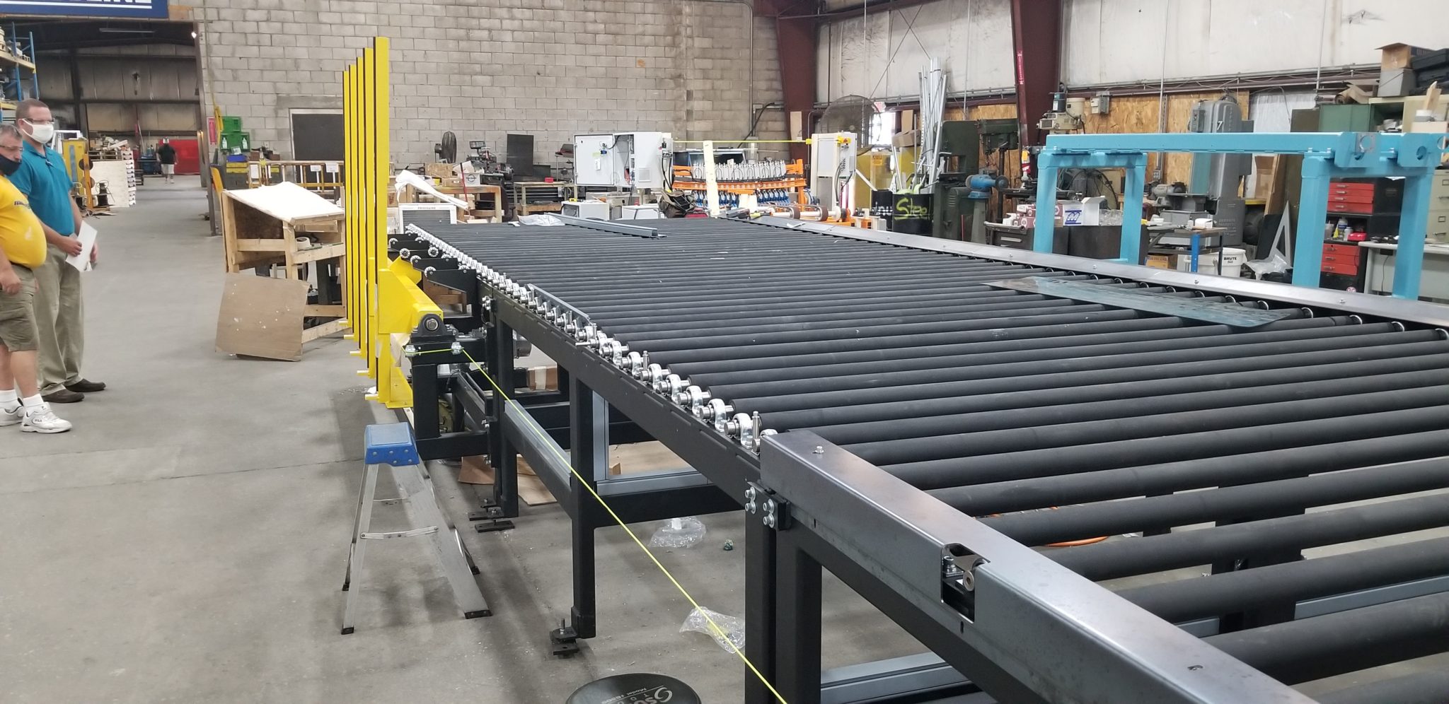 Tilting Load/Unload Bars, with Conveyor. - GlassLine